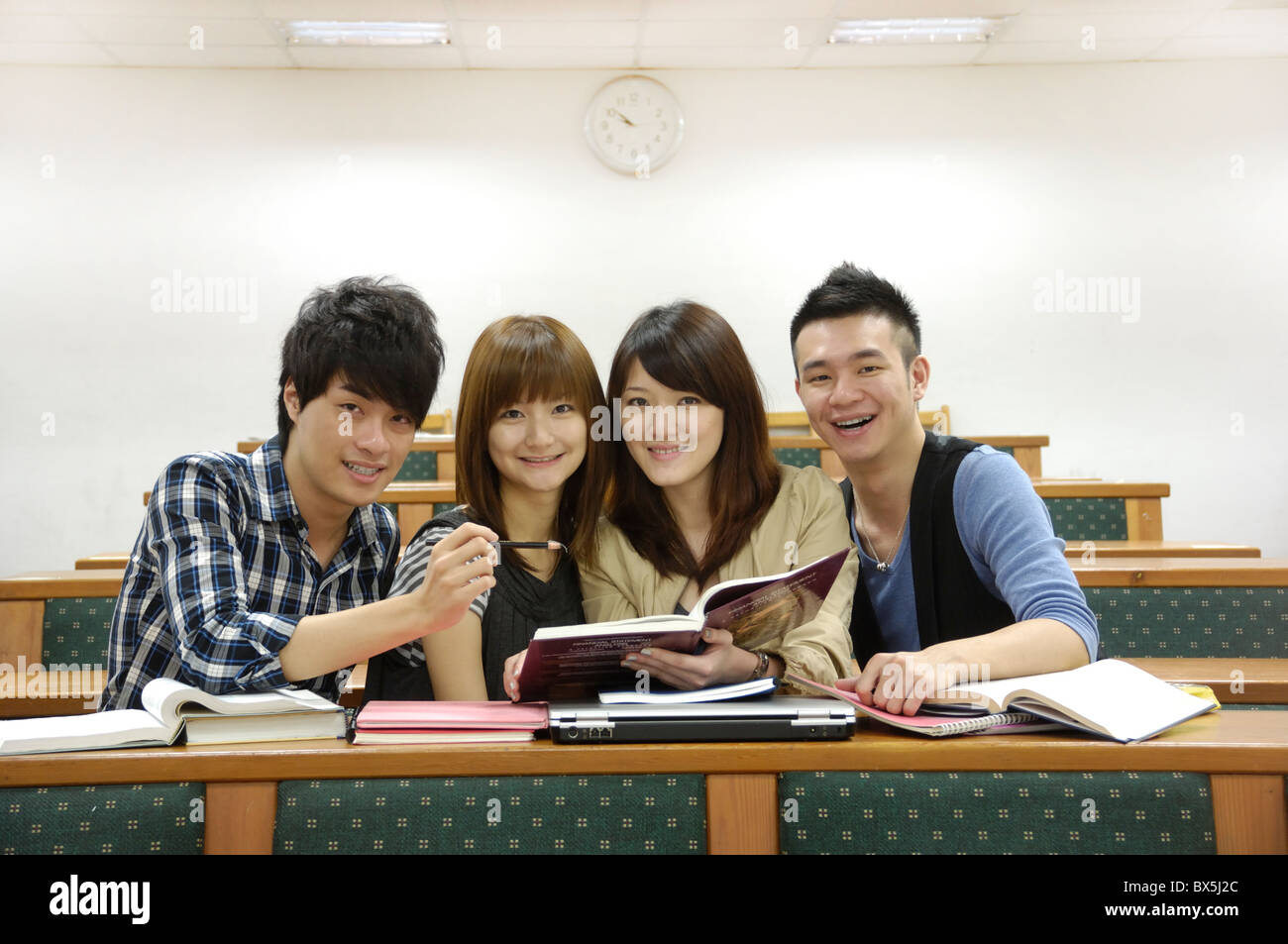 University students smiling in a classroom Stock Photo - Alamy