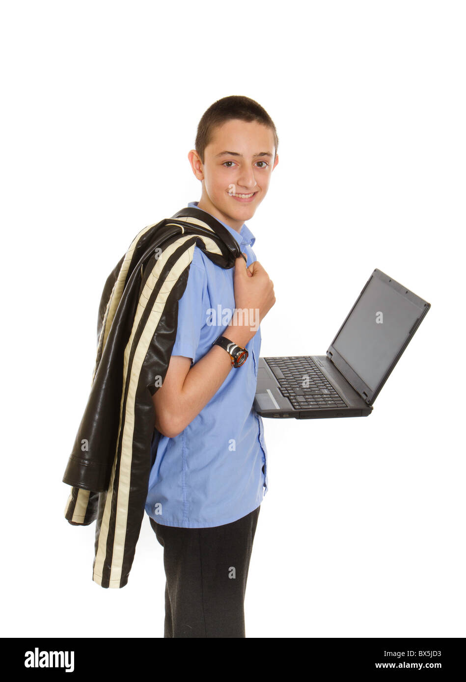 Teenage boy with laptop from the "Computer for Every Child" program ...