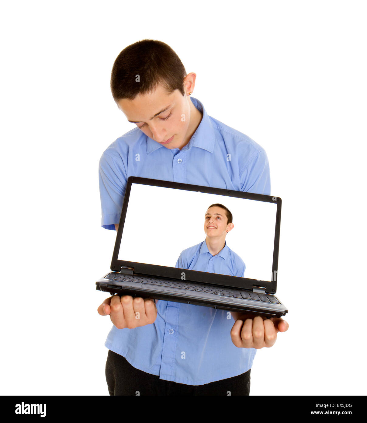 Teenage boy with laptop from the "Computer for Every Child" program ...