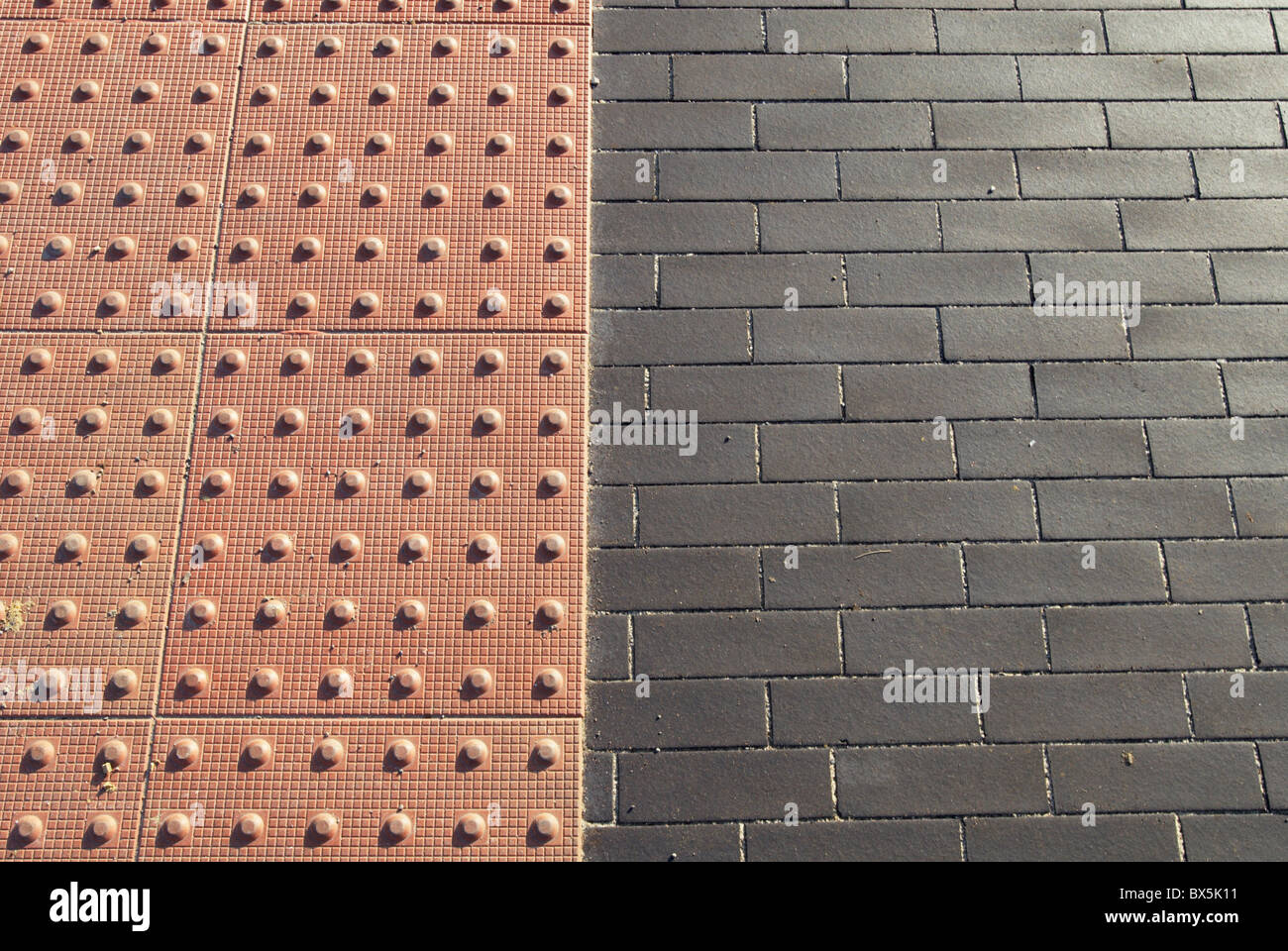 Textured paving for crossing point Stock Photo - Alamy