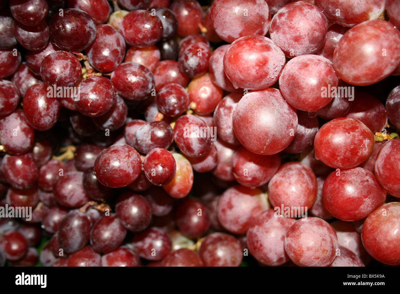 Red grapes in a market in Thailand Stock Photo - Alamy
