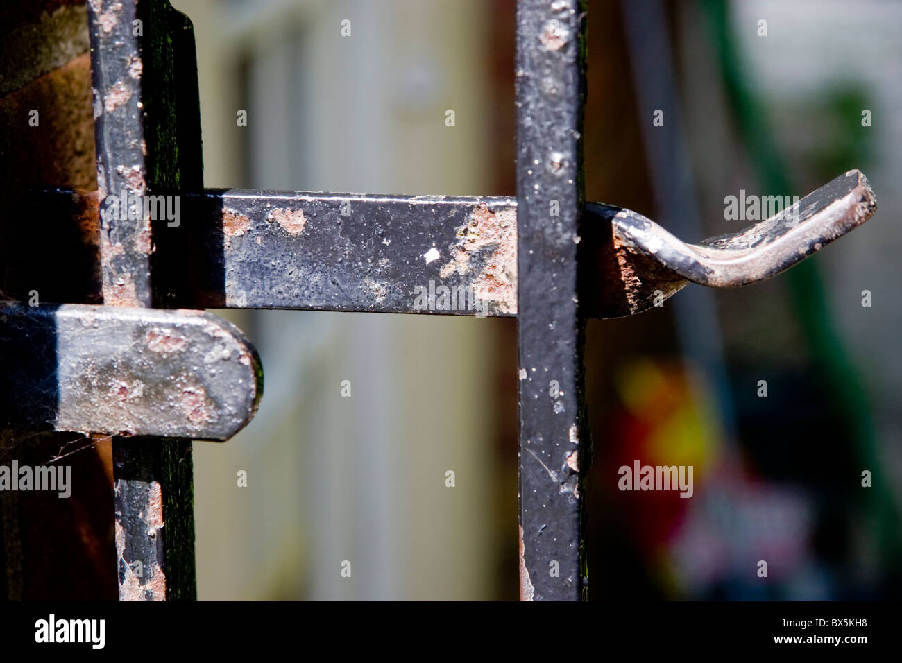 Catch on a wrought iron gate Stock Photo - Alamy