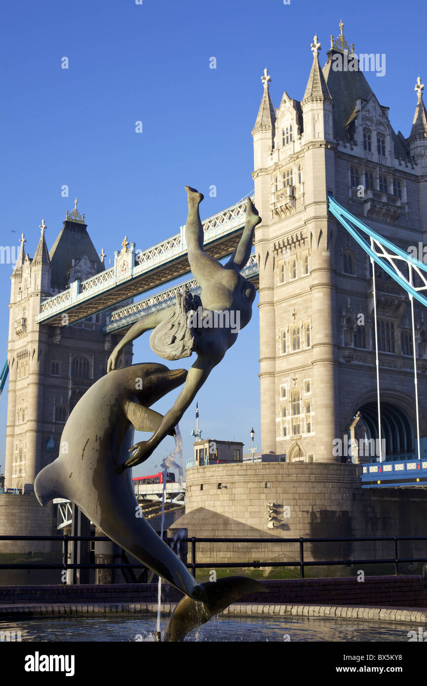 Girl and the dolphin statue and Tower Bridge, London, England, United ...