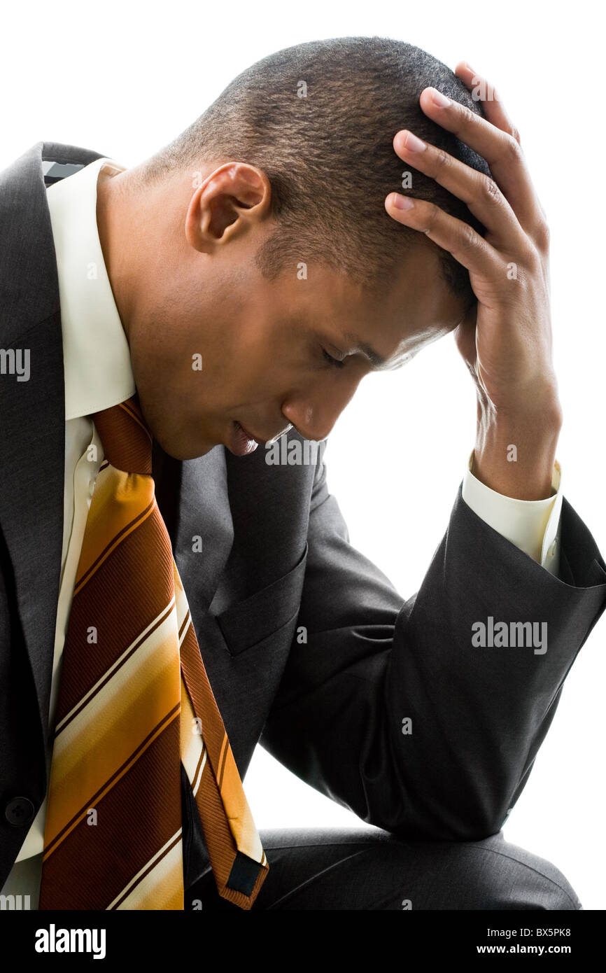 Photo of businessman sitting in pose of thinker on white background ...
