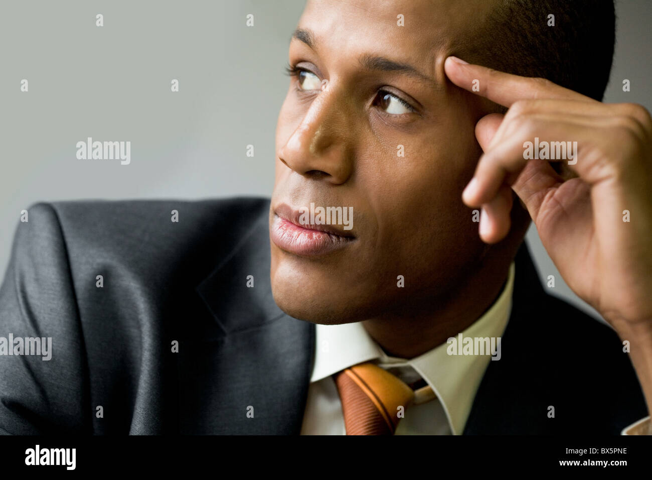 Serious employee looking aside hi-res stock photography and images - Alamy
