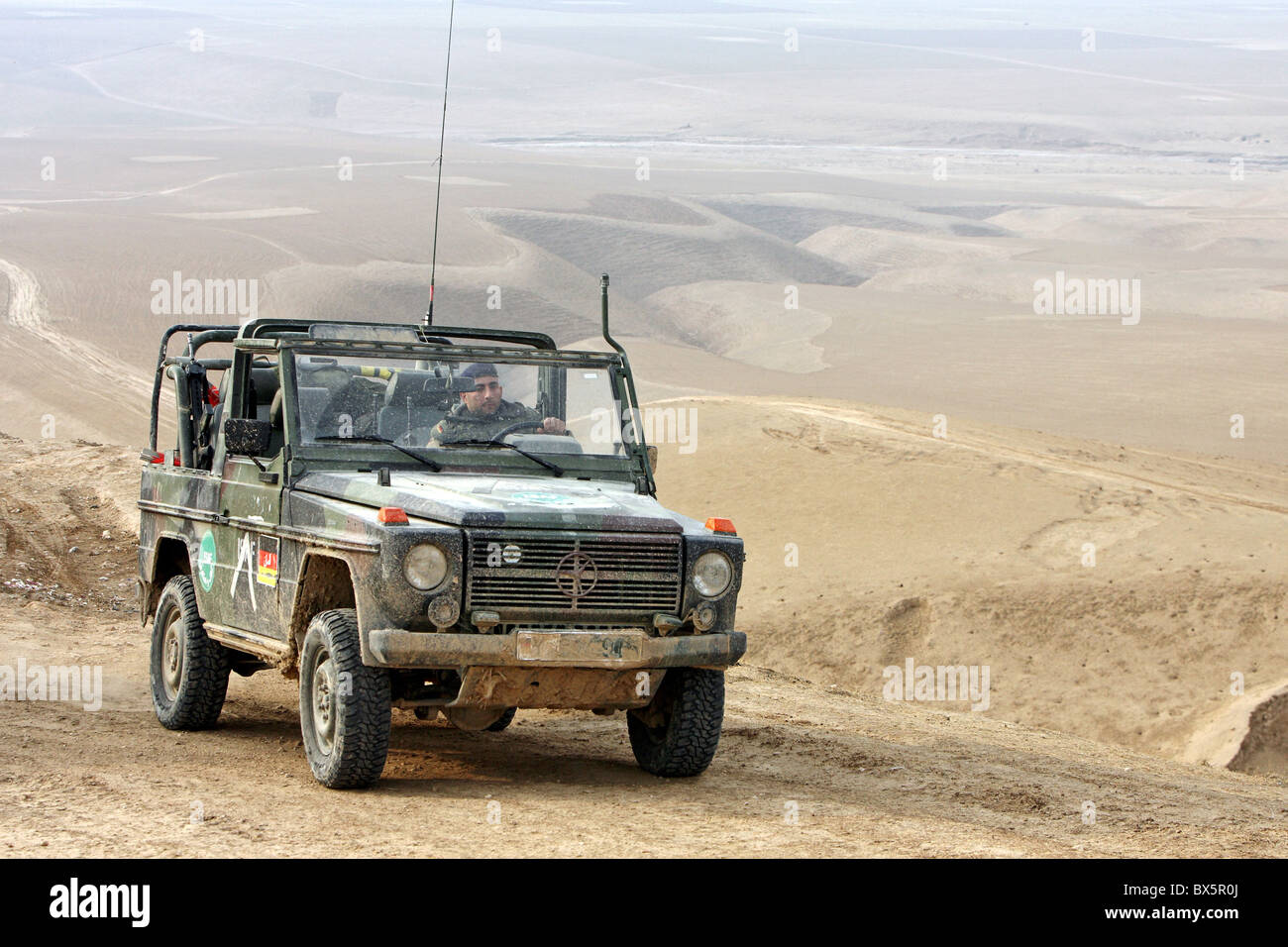Bundeswehr soldier of the ISAF patrol on the way in a Wolf car in the ...