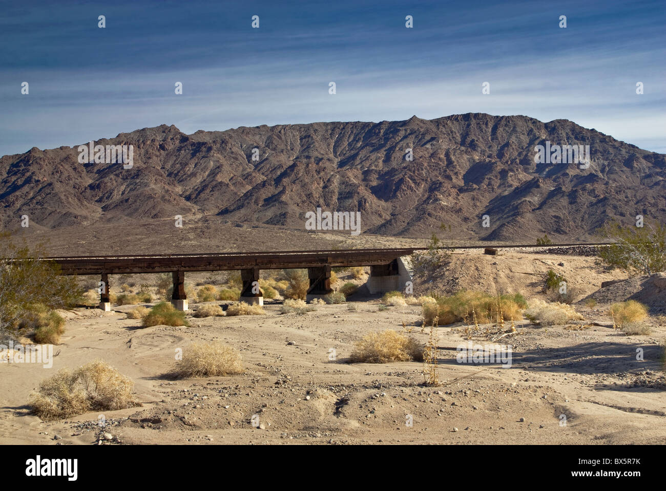 Railway bridge over arroyo, Cadiz Road, Ship Mountains in dist, Mojave ...