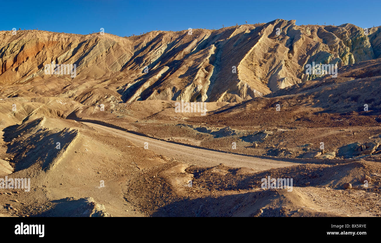 Dirt road, rock formations at Rainbow Basin National Natural Landmark ...