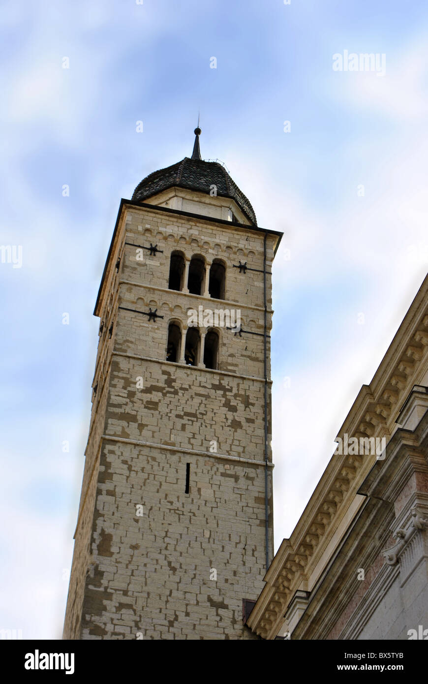 stone bell tower with a cross and blue sky background Stock Photo - Alamy