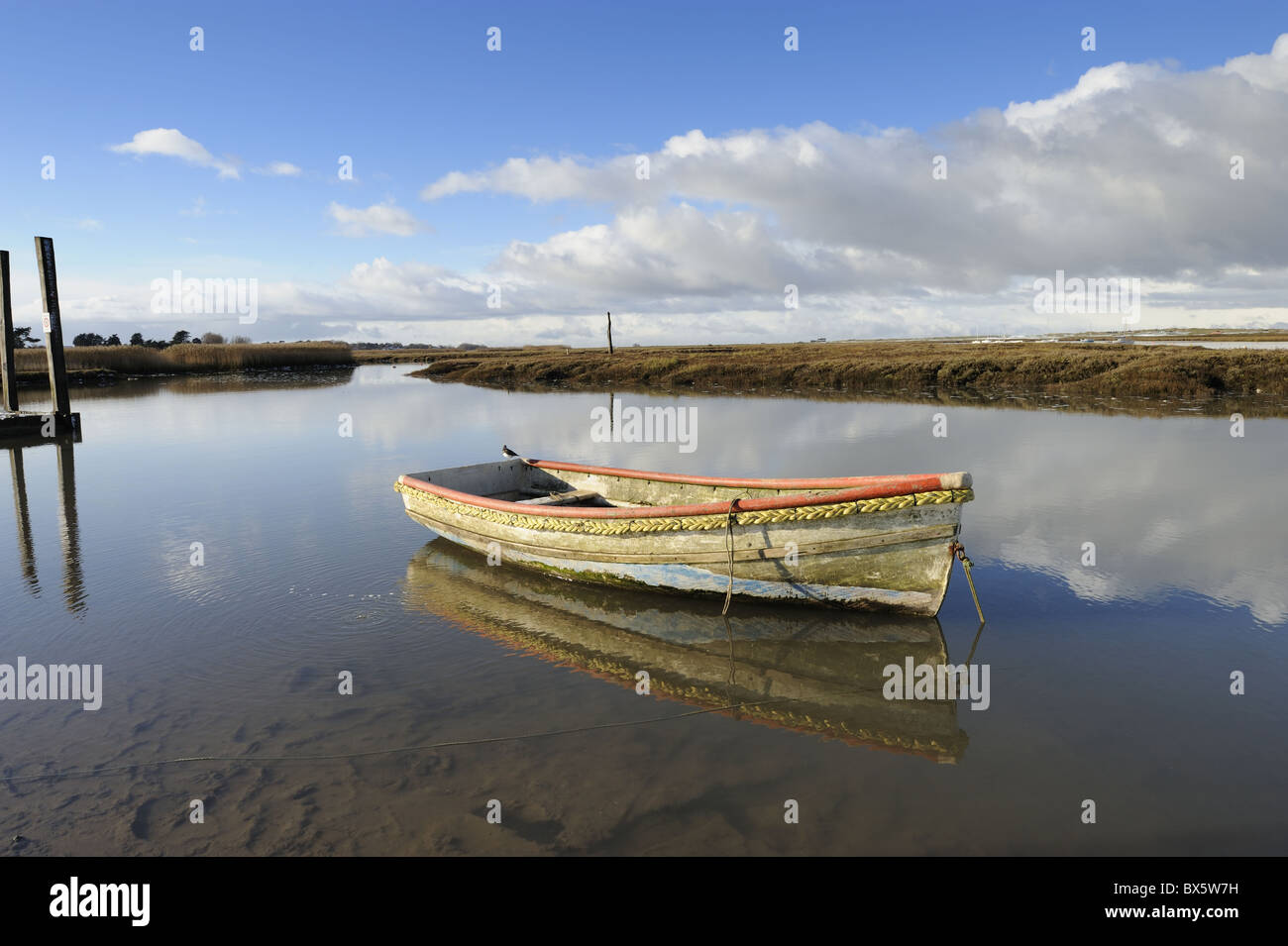 Boat in tidal creek, Brancaster, Norfolk, UK, November Stock Photo - Alamy