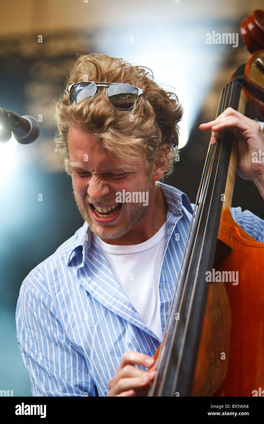 Ted Dwane of the band Mumford & Sons plays string bass and sings vocals ...