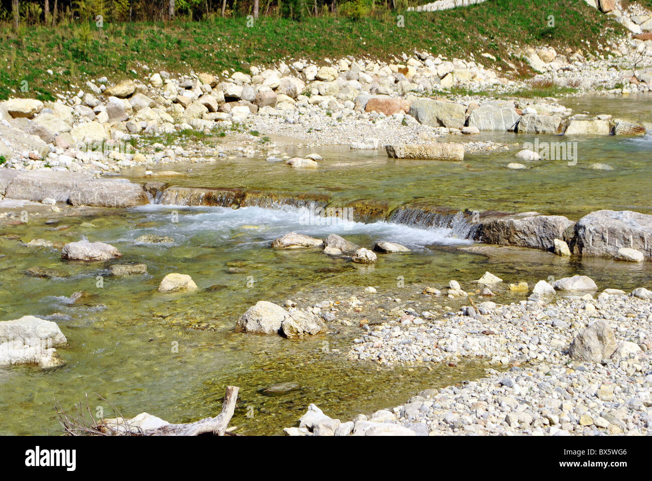 freshwater stream with small waterfall Stock Photo - Alamy