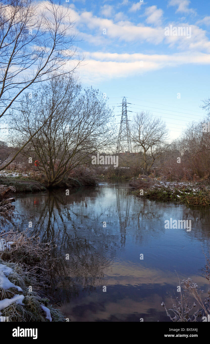 The River Yare in winter with reflections flowing by Earlham Park ...