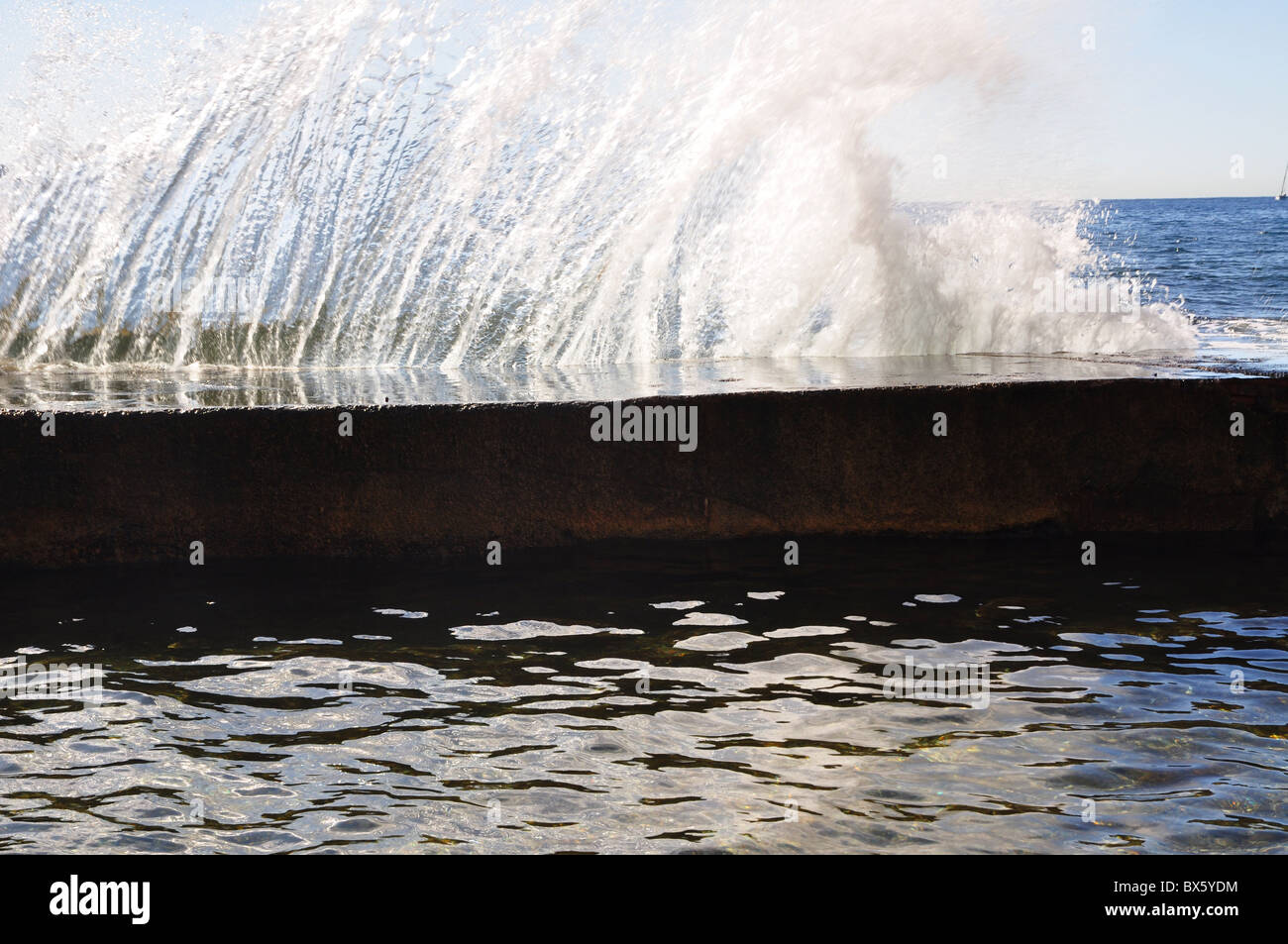 Wave on a breakwater Stock Photo - Alamy