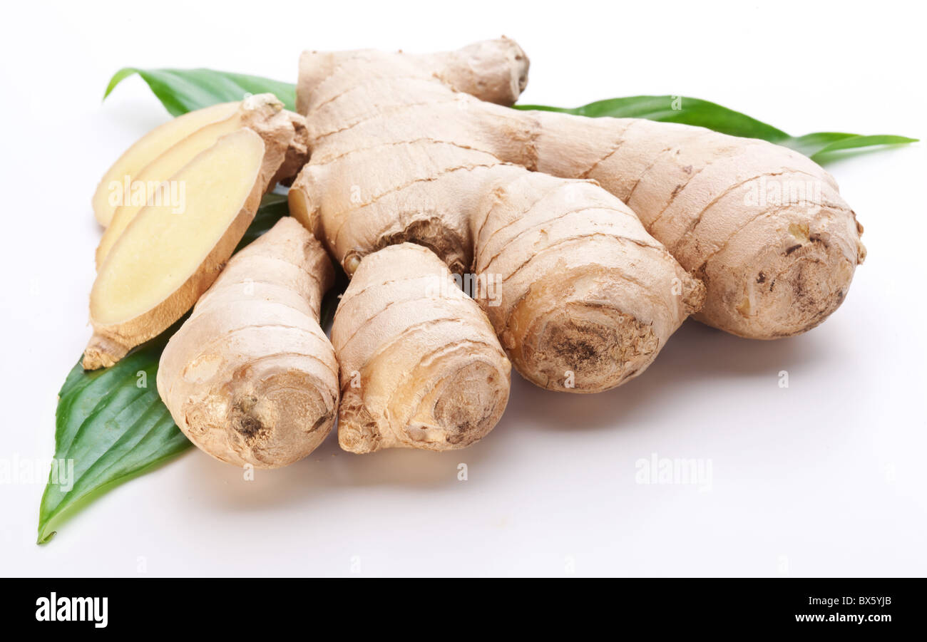 Fresh ginger with leaves isolated on white background Stock Photo - Alamy