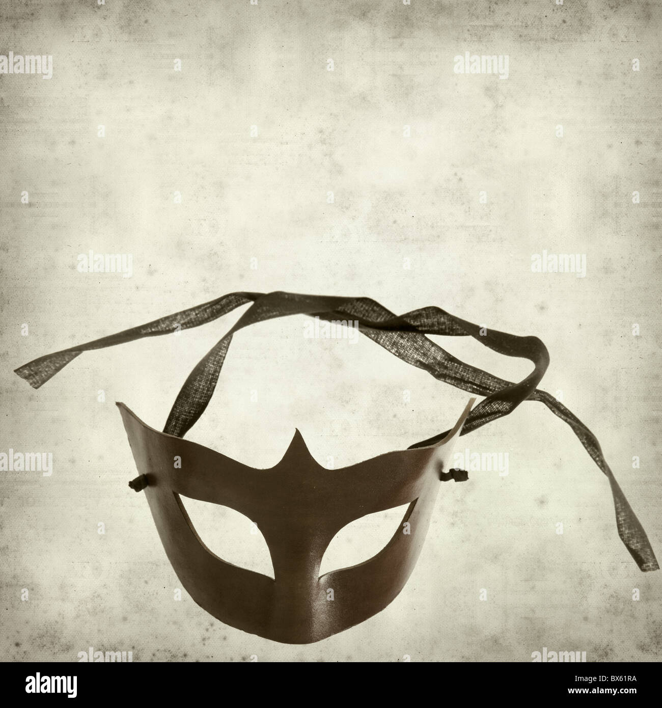 textured old paper background with leather half-mask Stock Photo - Alamy