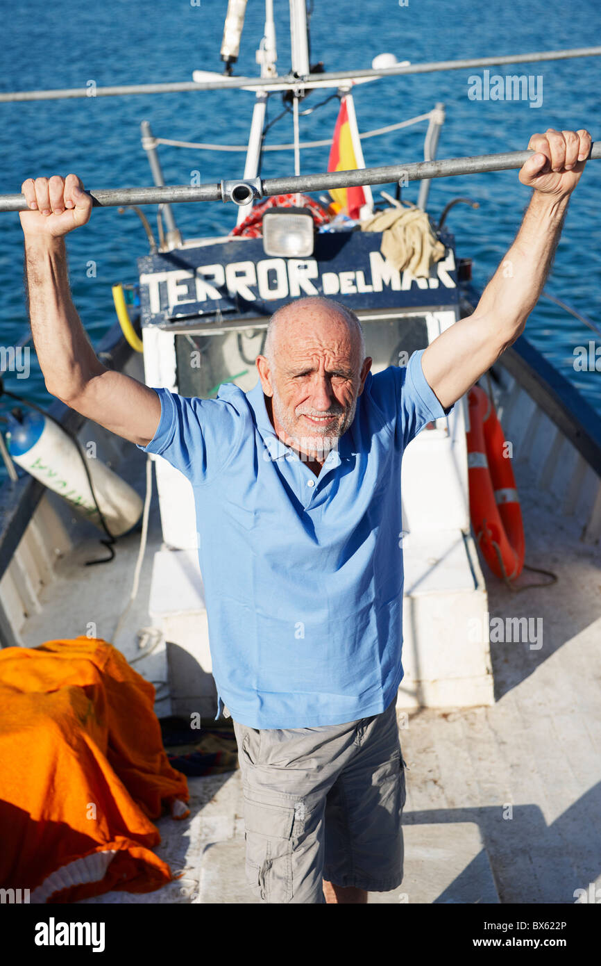 Fisherman on fishing boat Stock Photo - Alamy