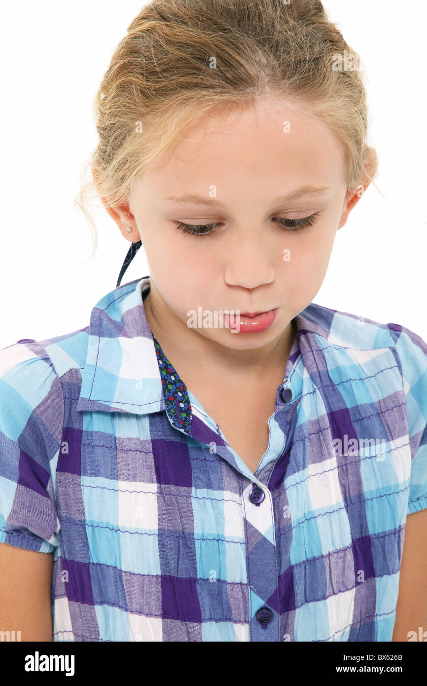 Beautiful little sad 7 year old girl in blue dress over white ...