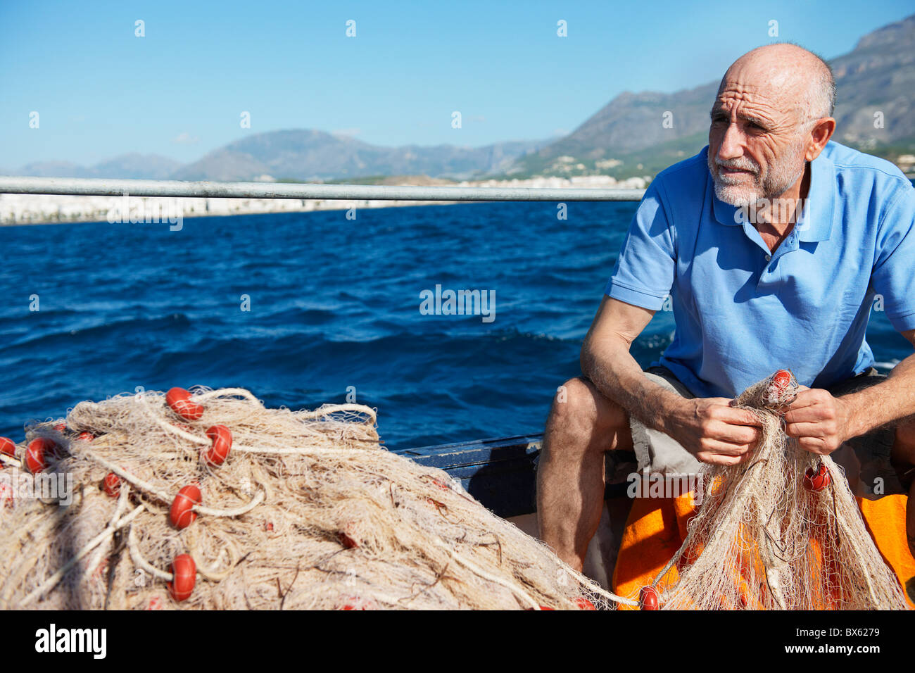 Man holding nets hi-res stock photography and images - Alamy