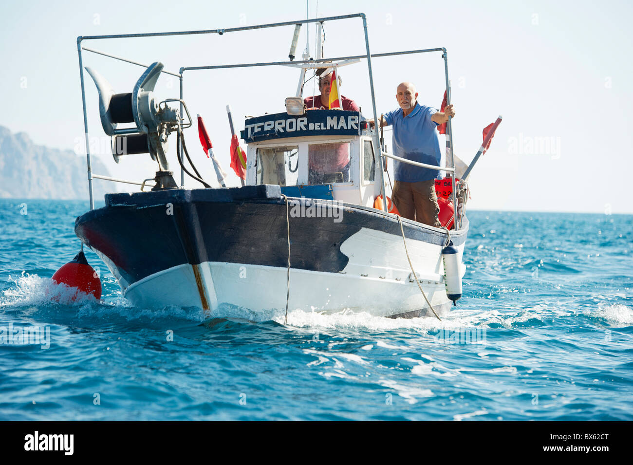 Fishermen on fishing boats Stock Photo - Alamy