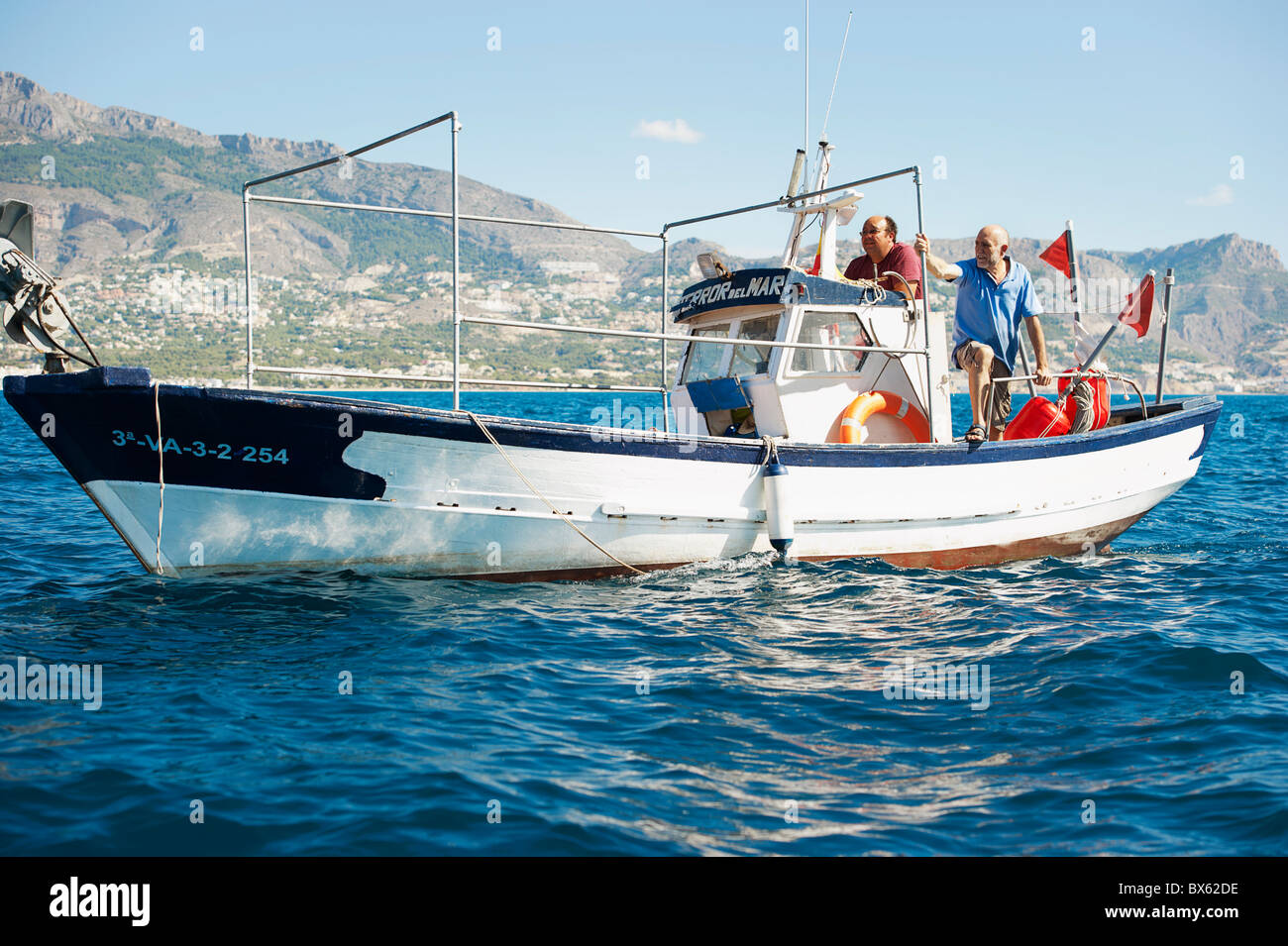 Fisherman and fishing boat hi-res stock photography and images - Alamy