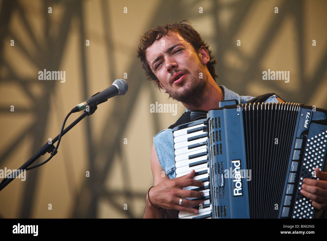 Ben Lovett of the band Mumford & Sons plays accordion and sings vocals ...