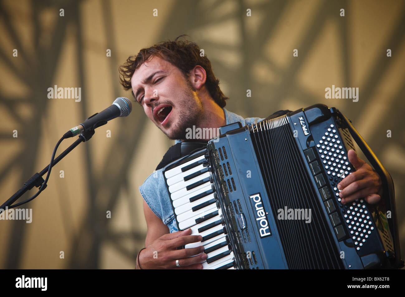 Ben Lovett of the band Mumford & Sons plays accordion and sings vocals ...