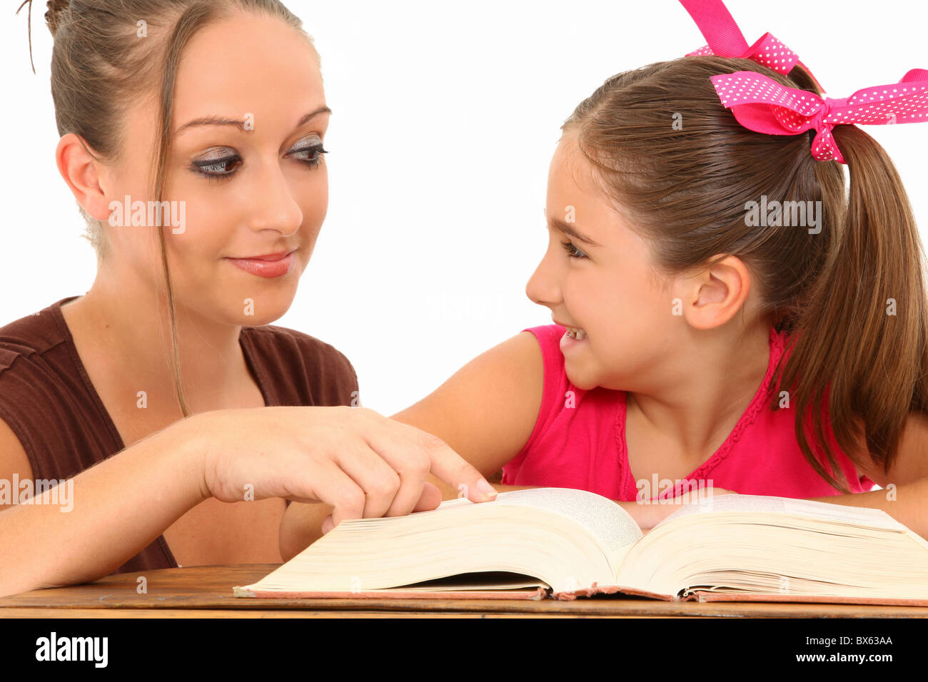 Beautiful 27 year old american teacher helping 7 year old student at ...