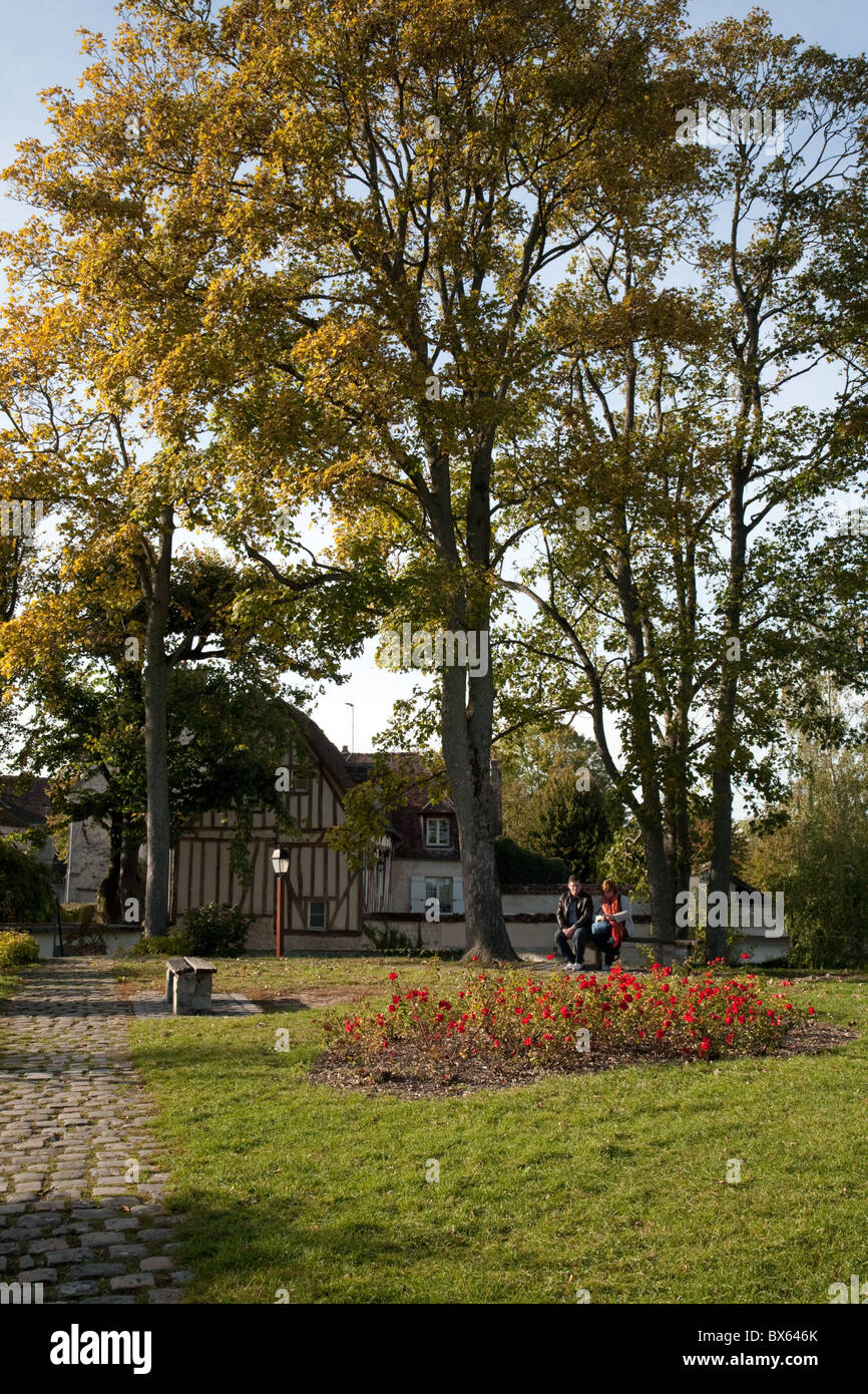 People sitting in Le Jardin des Breban (Breban Garden), the medieval ...