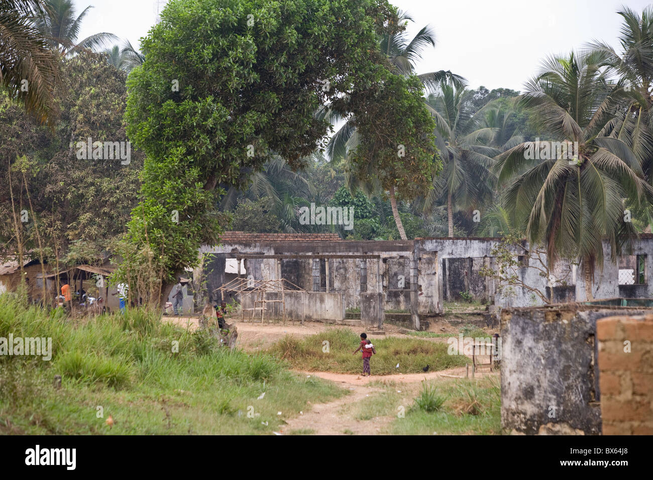 War damaged buildings still stand in the town of Kakata, Liberia, in ...