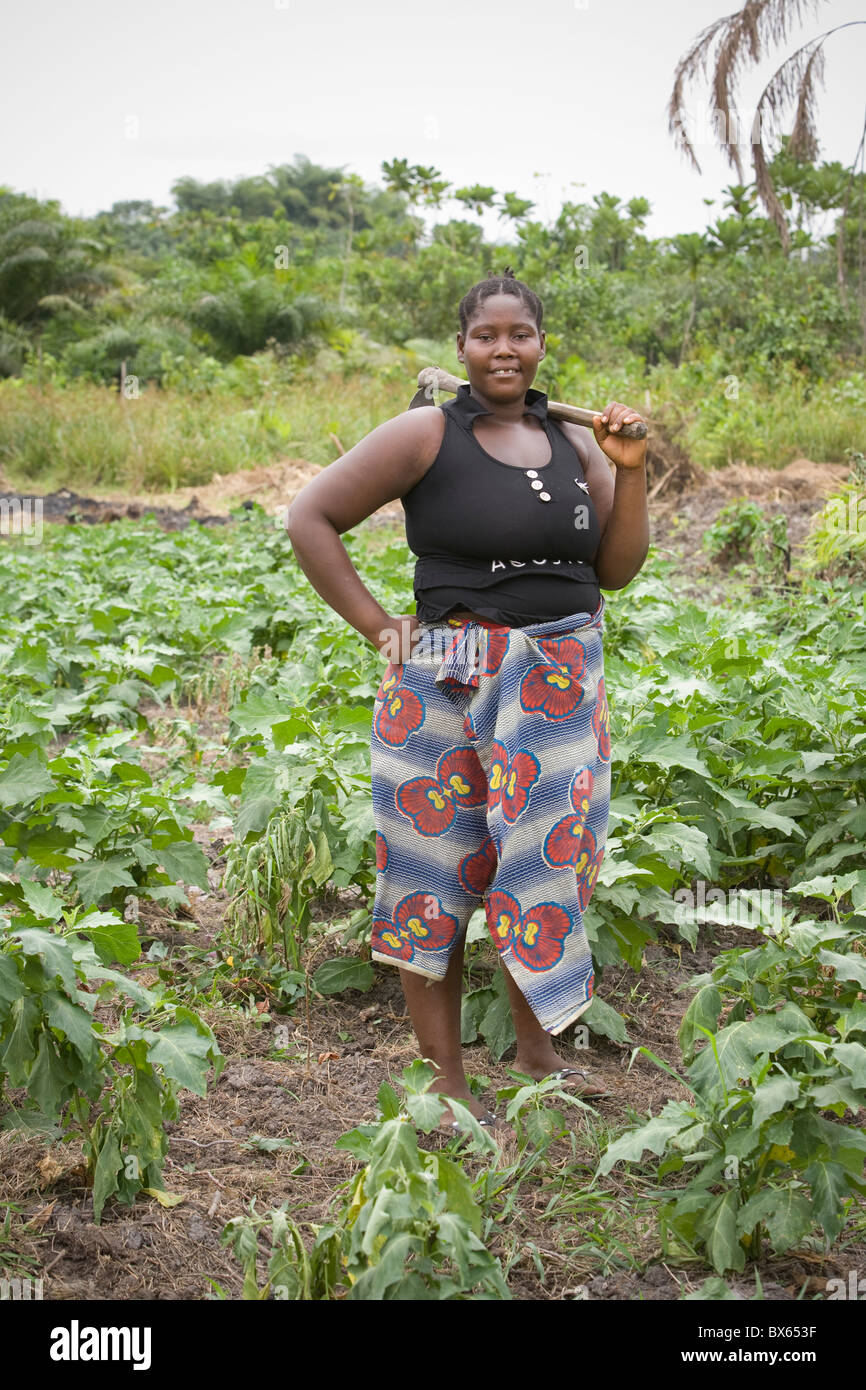 A female farmer stands in her field in Kakata, Liberia, West Africa ...
