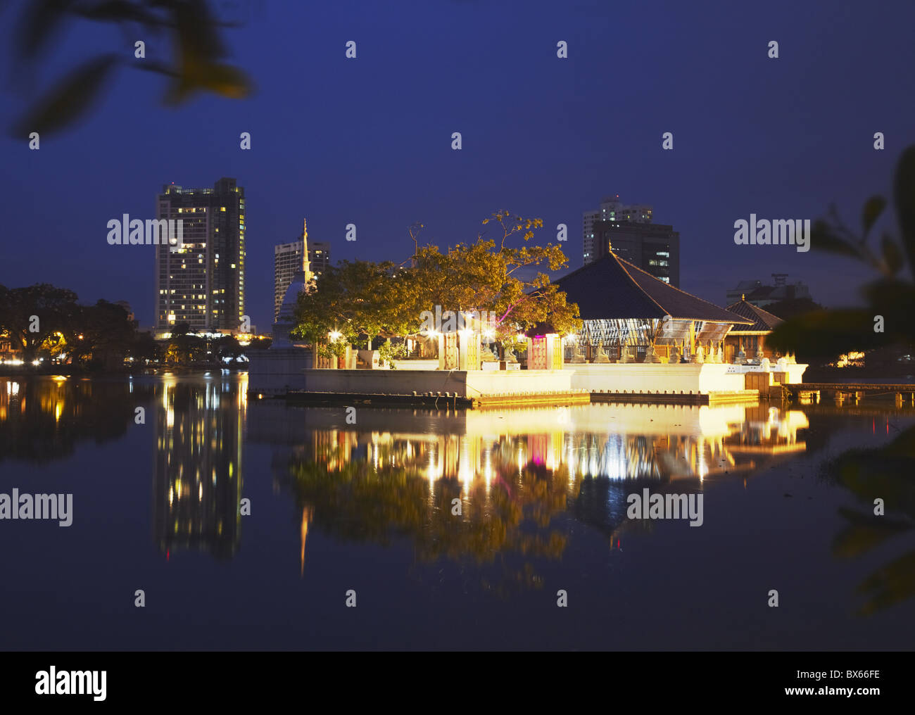 Seema Malakaya Temple on Beira Lake at dusk, Cinnamon Gardens, Colombo ...