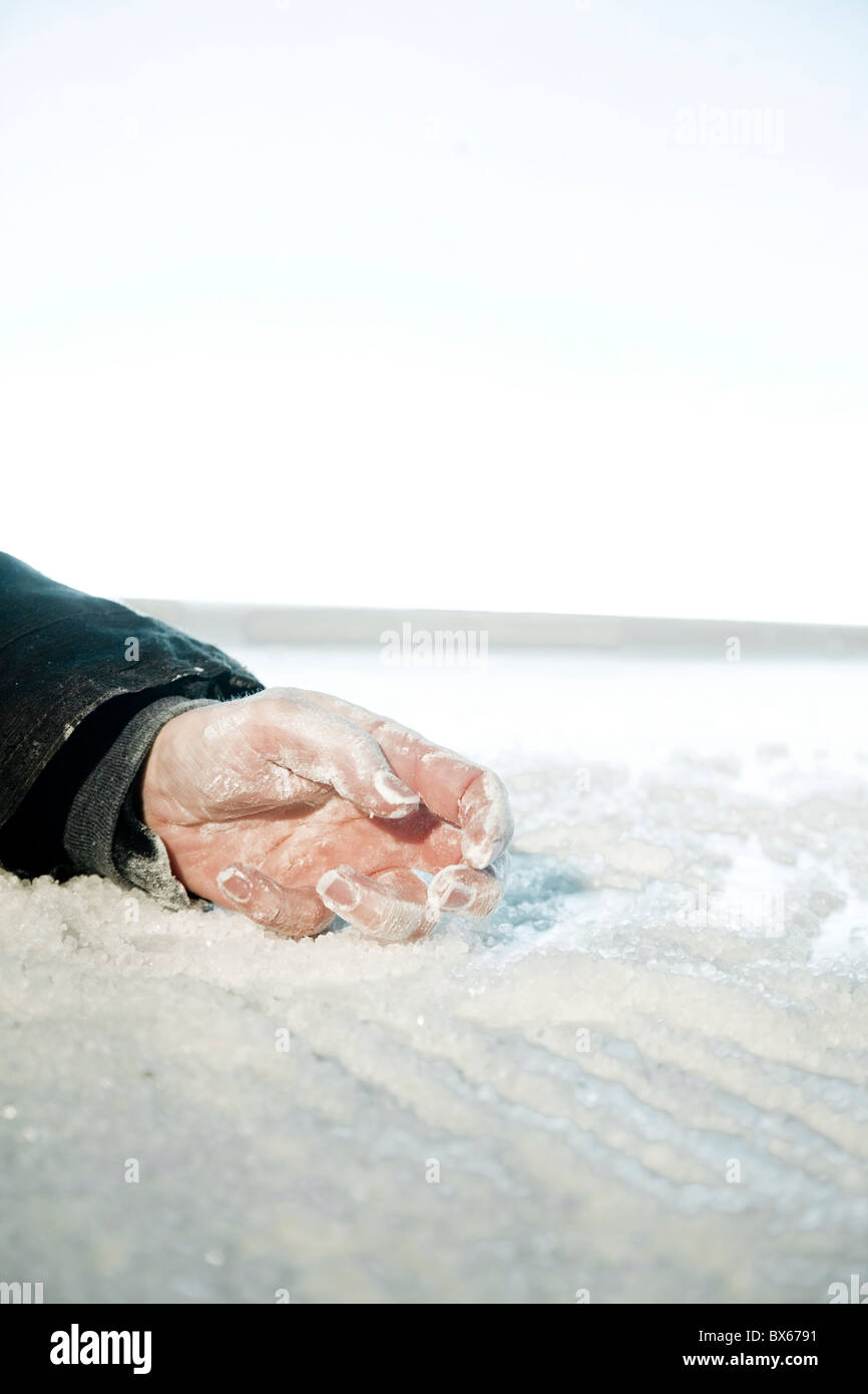 frozen hand lying on snow and ice. exterior location Stock Photo - Alamy