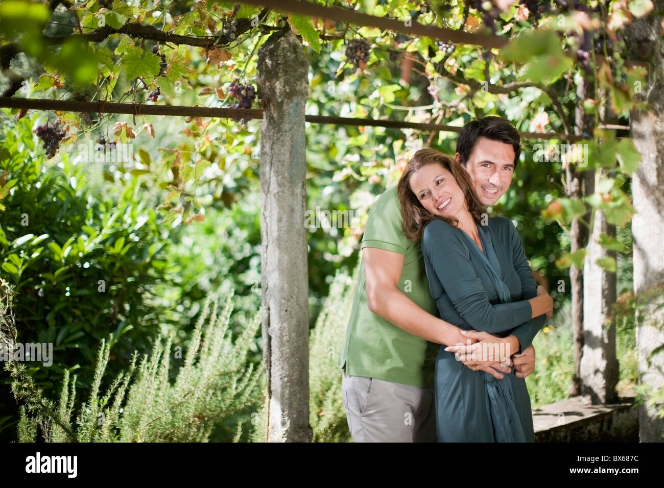 Two lovers hugging in nature Stock Photo - Alamy