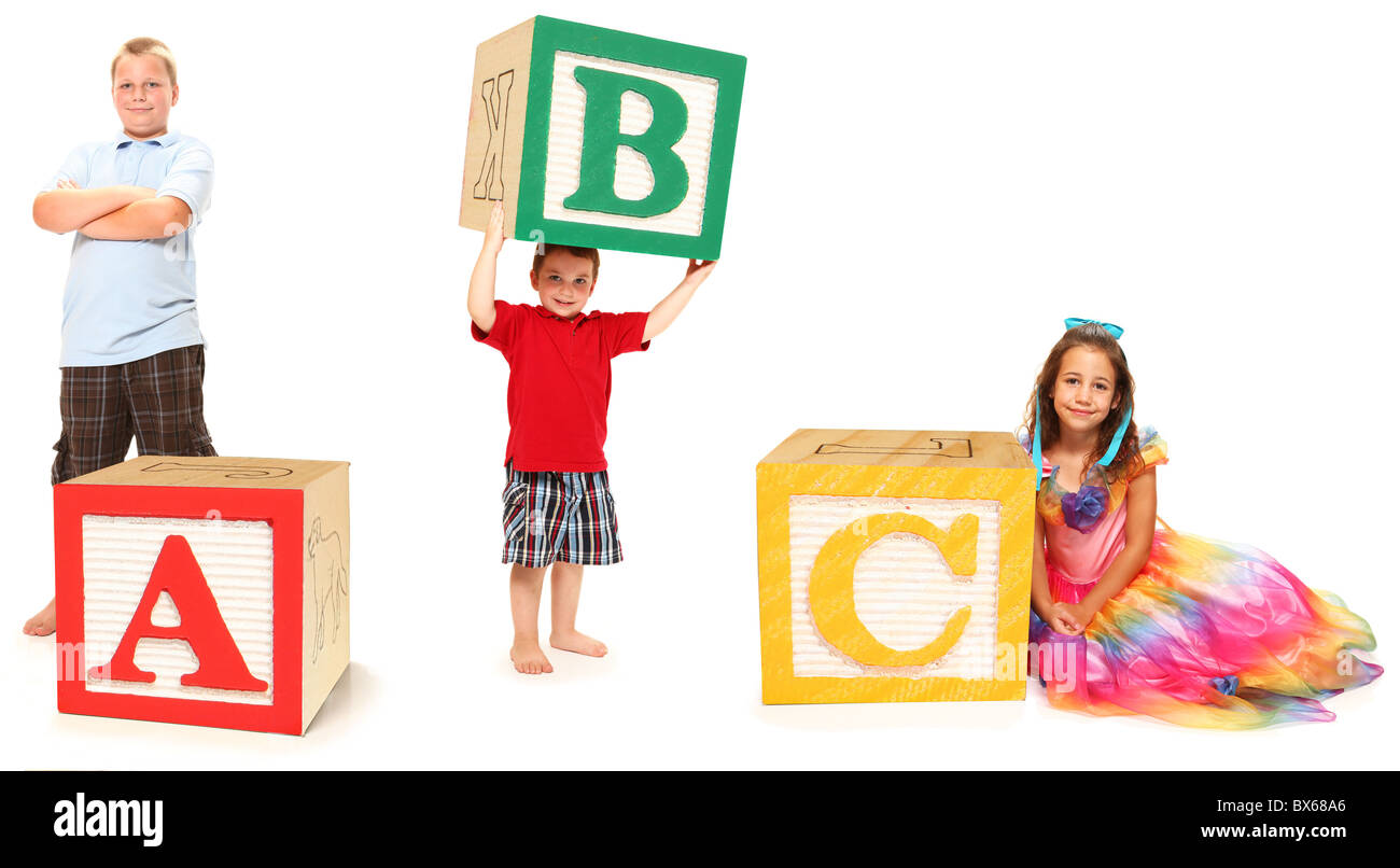 Children with ABC spelled out in colorful alphbet blocks over white ...