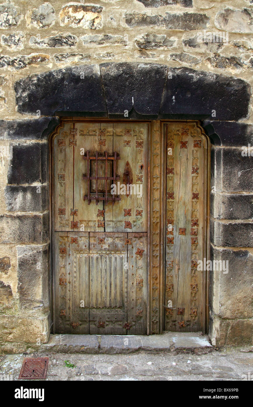 Medieval wooden door in stone wall Pyrenees Aragon Spain Stock Photo ...