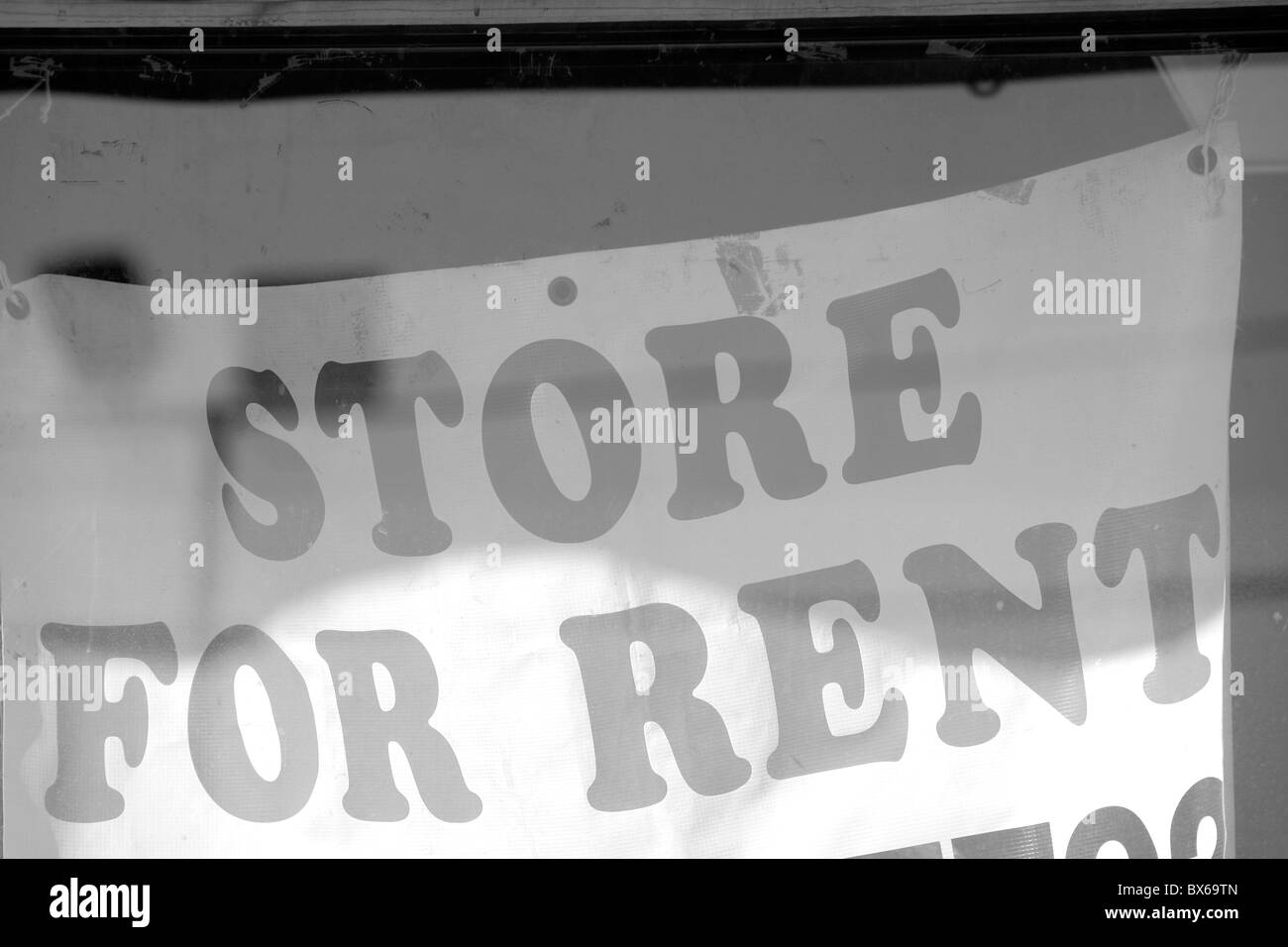 Red and White Store For Rent sign behind glass window Stock Photo - Alamy