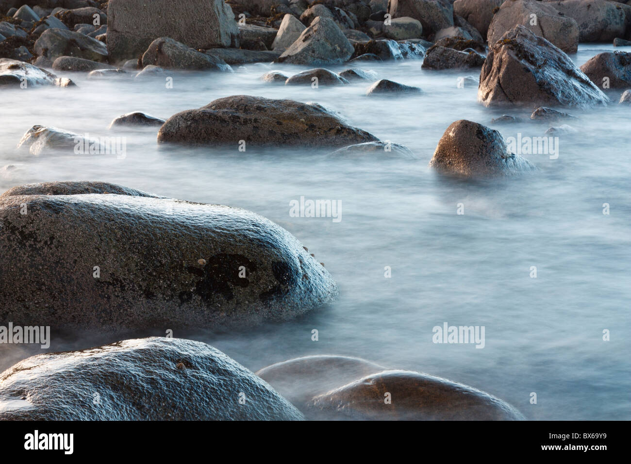 Lewisian Gneiss rocks in silky water Stock Photo - Alamy