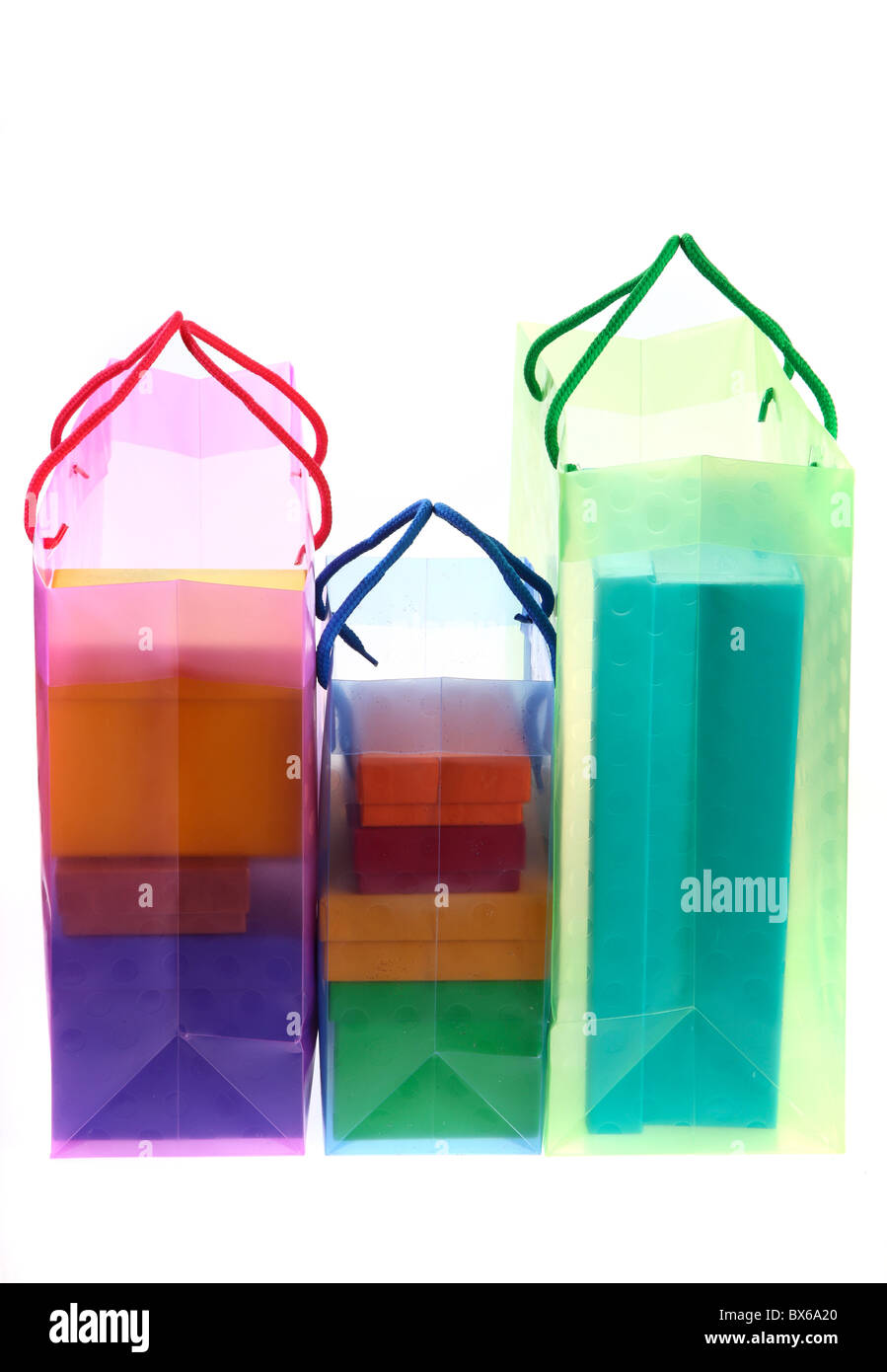Colorful, transparent, plastic gift bags, filled with cardboard boxes ...