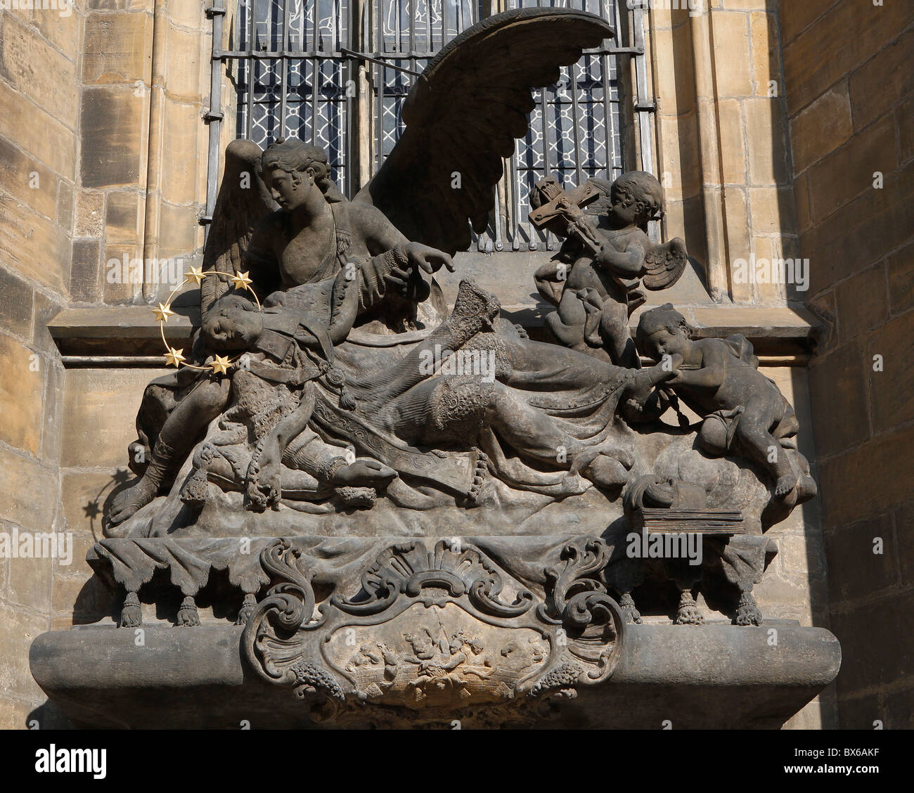 Prague, statue of angels mounted on the side of St. Vitus Cathedral ...