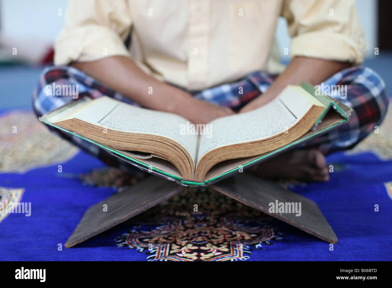 Muslim man reading quran in the mosque hi-res stock photography and ...