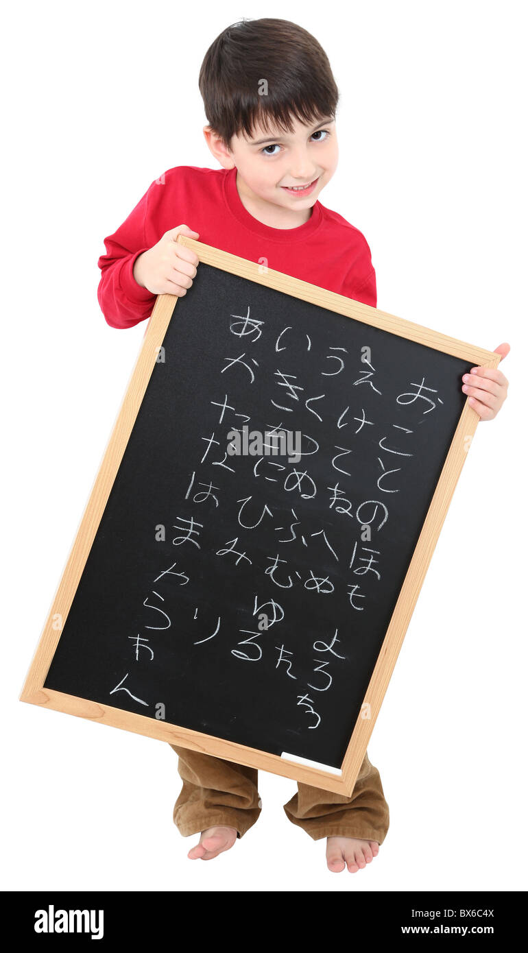Adorable six year old boy with chalkboard displaying Japanese alphabet ...