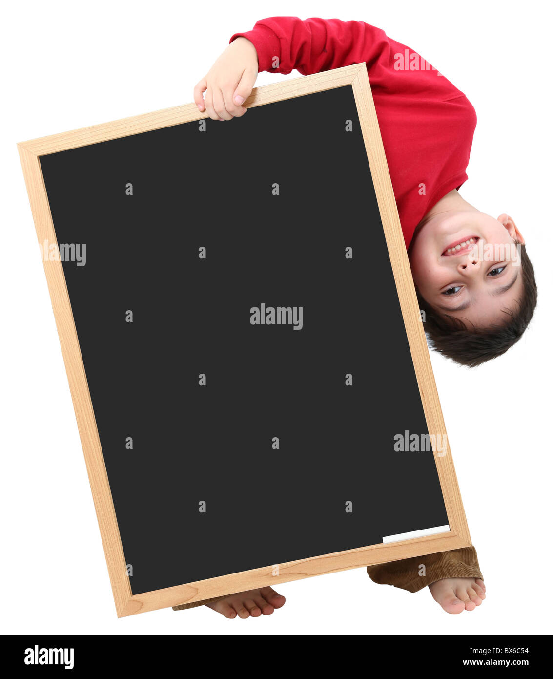 Adorable six year old school boy with blank chalkboard with clipping ...