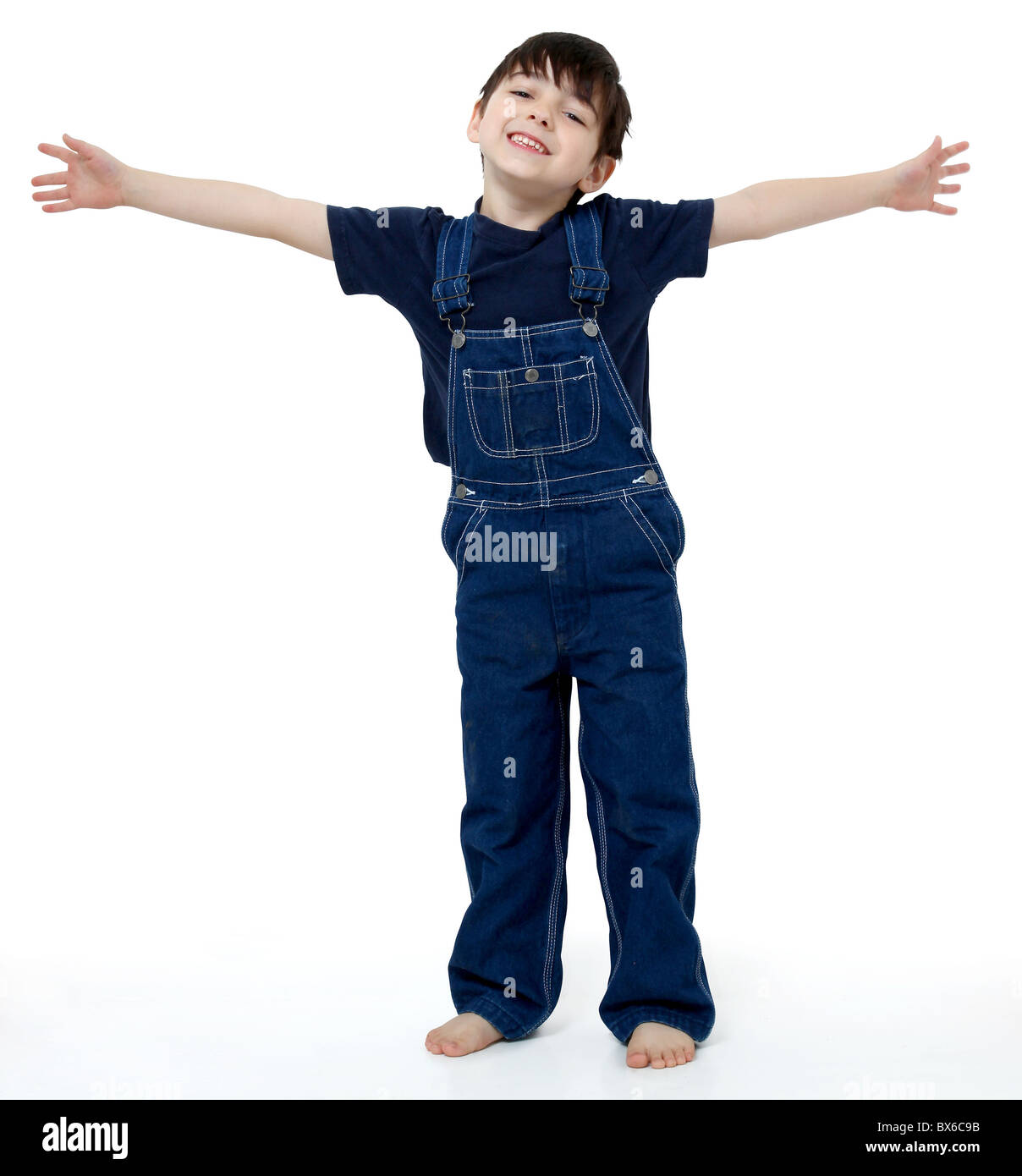 Adorable Six Year Old Boy In Overalls With His Arms Stretched Out To adorable-six-year-old-boy-in-overalls-with-his-arms-stretched-out-to