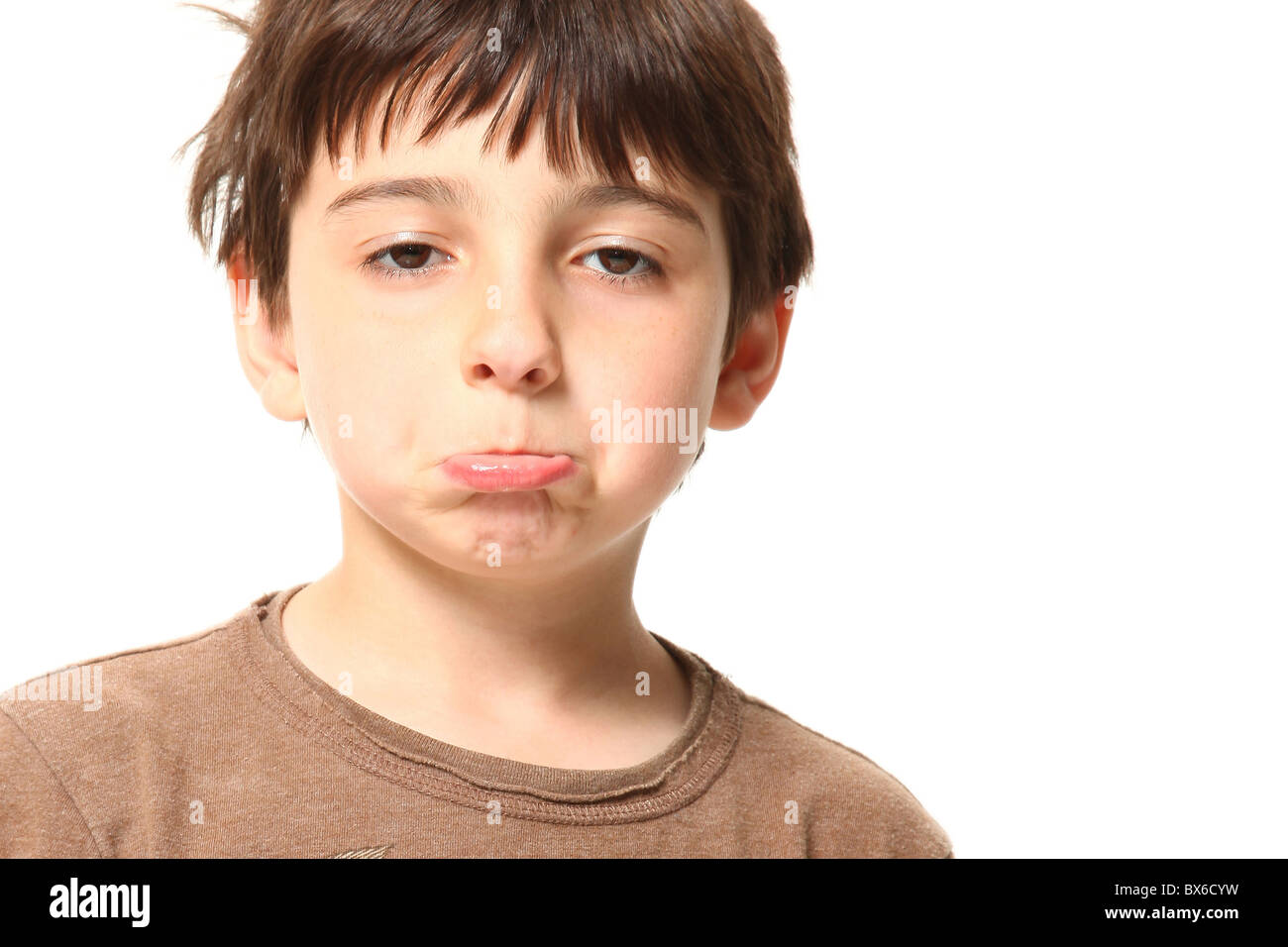 Seven year old boy with a sad pouting face Stock Photo - Alamy