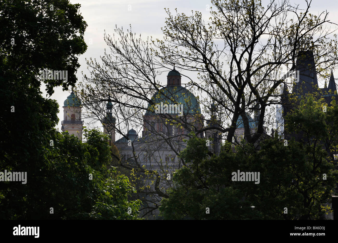 View of Old Town towers viewed through tree branches in Prague, Czech ...