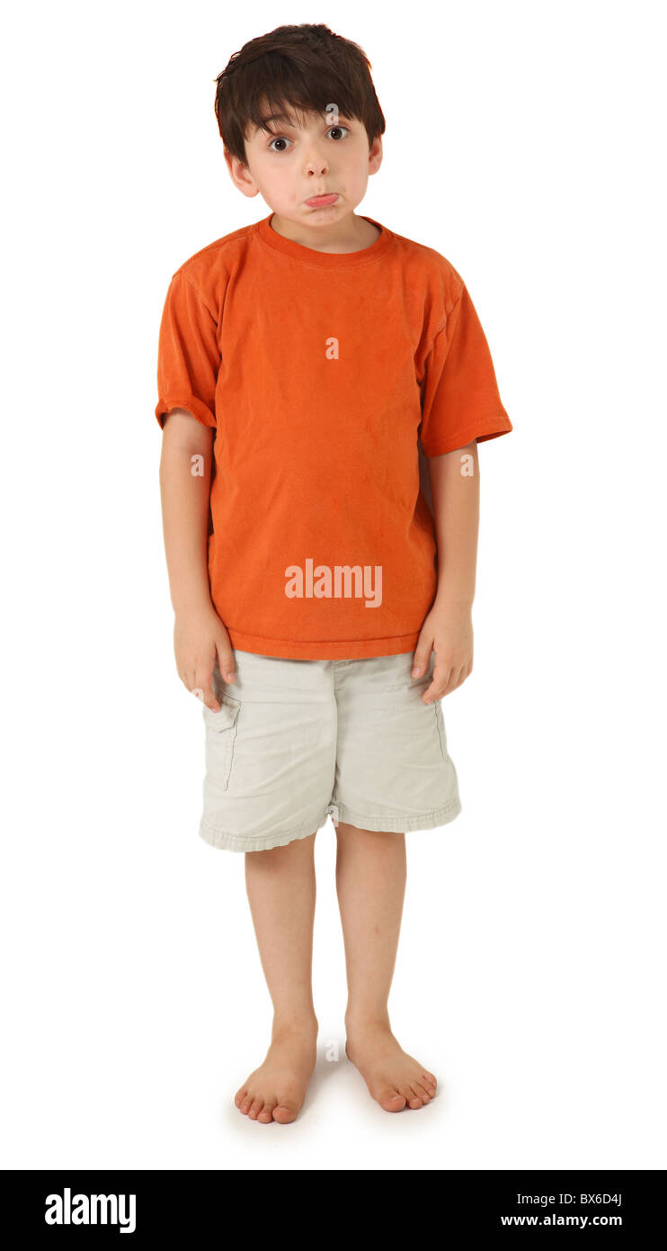 Adorable seven year old boy with silly pouting expression and wide eyes ...