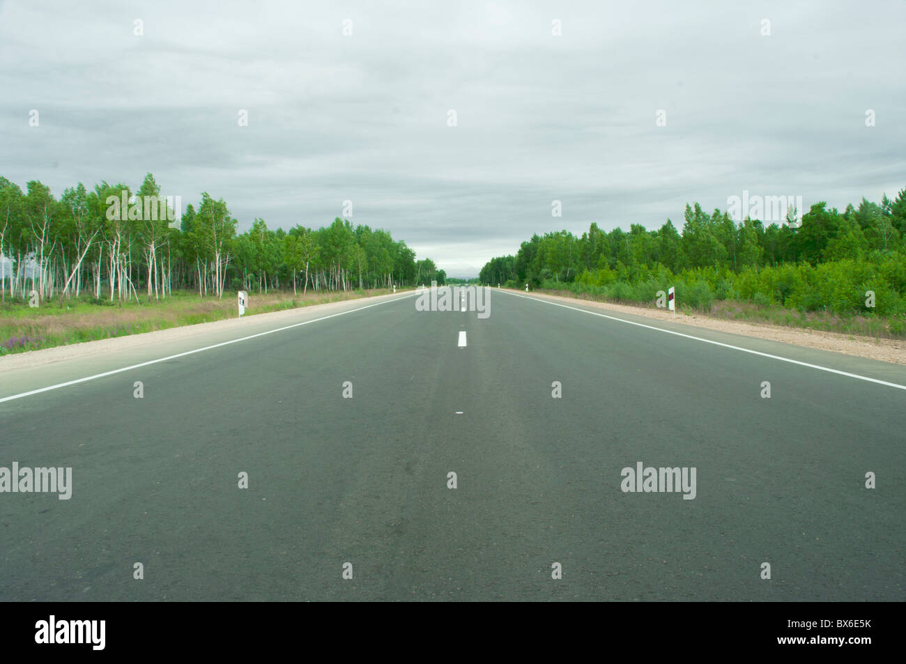 Direct road in the country leaving afar Stock Photo - Alamy