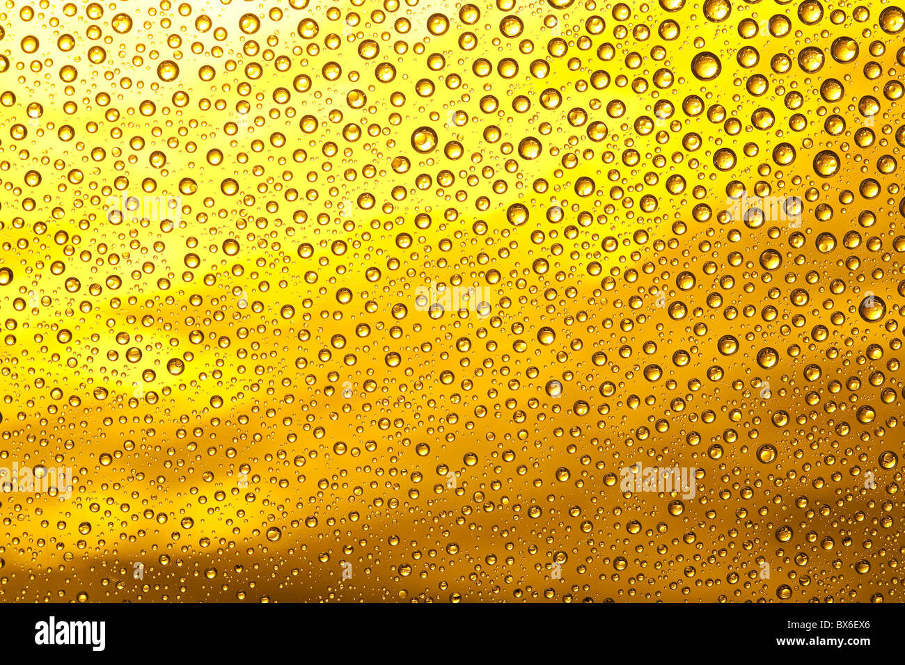 Golden water drops Stock Photo - Alamy
