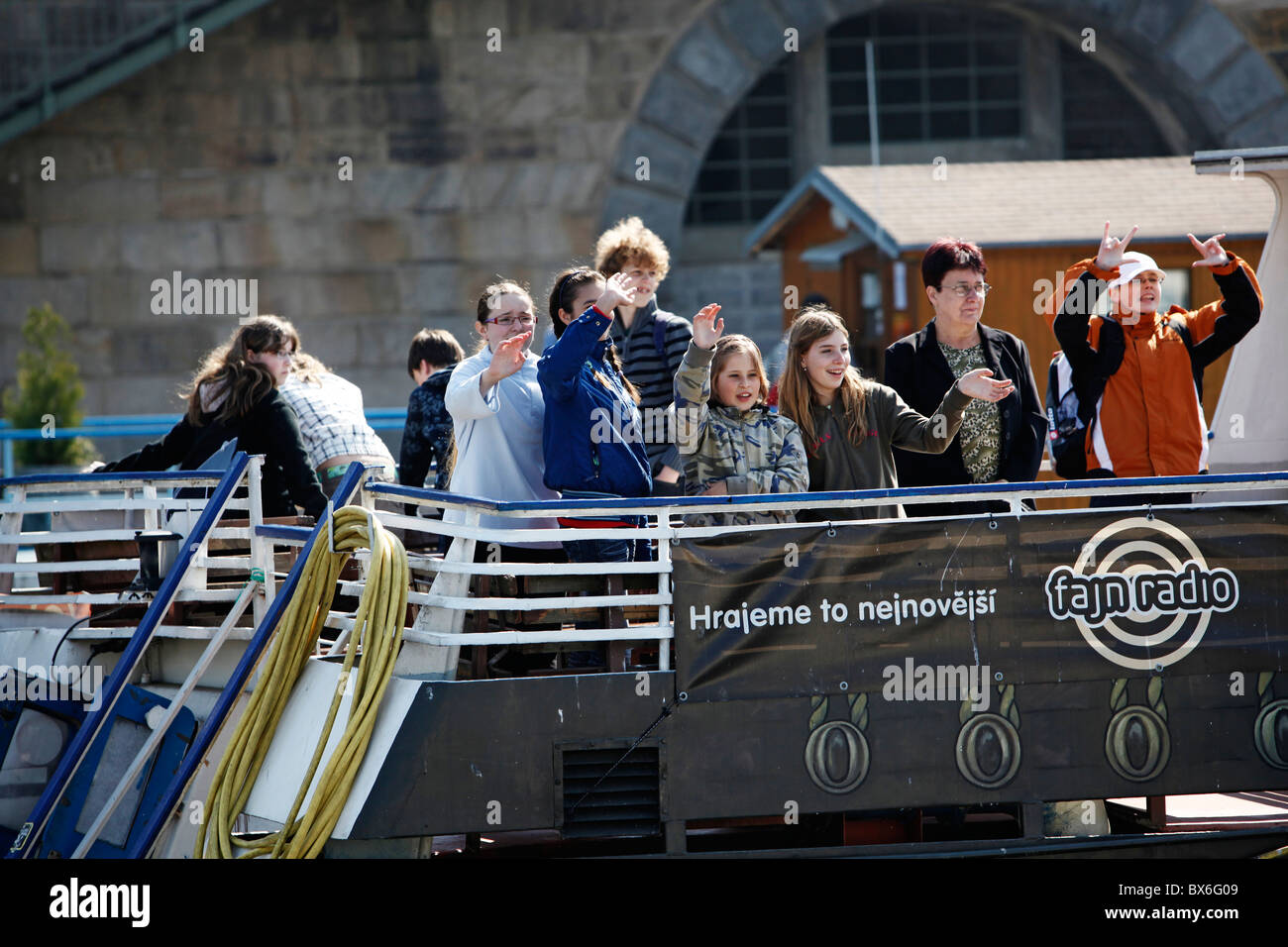 Prague, tourists waving their hands good bye, hello, happy, sightseeing ...